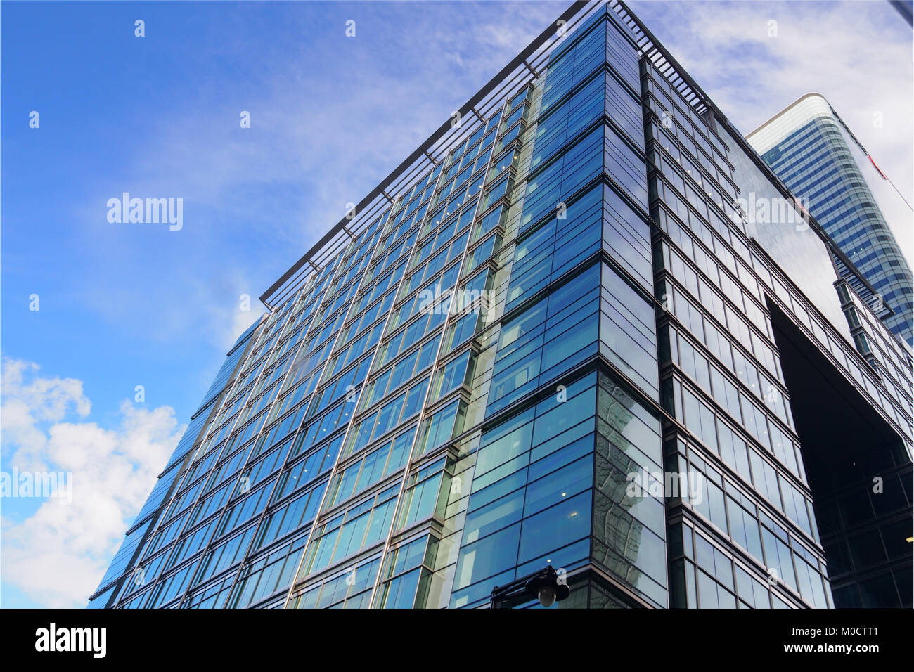 A view with reflections on tall,glass office buildings in the financial ...