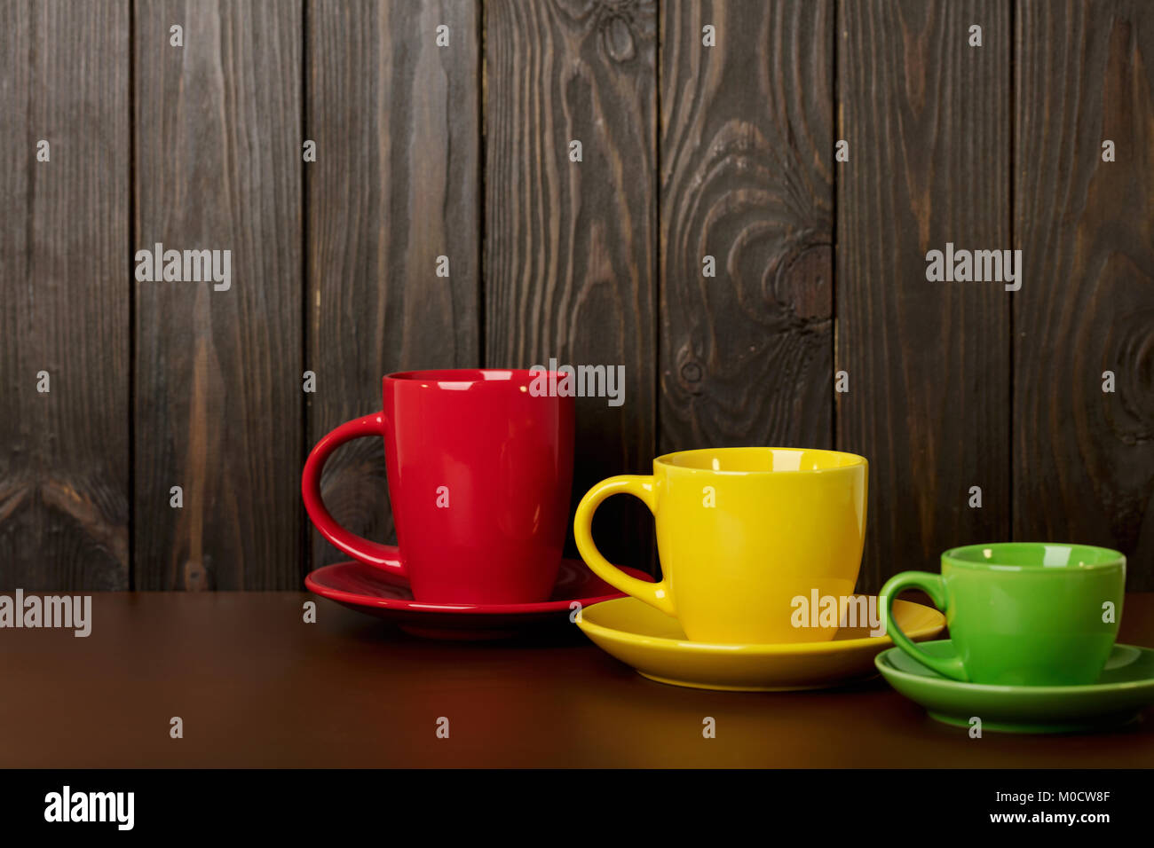 Different in size and color ceramic cups for coffee and tea - red ...