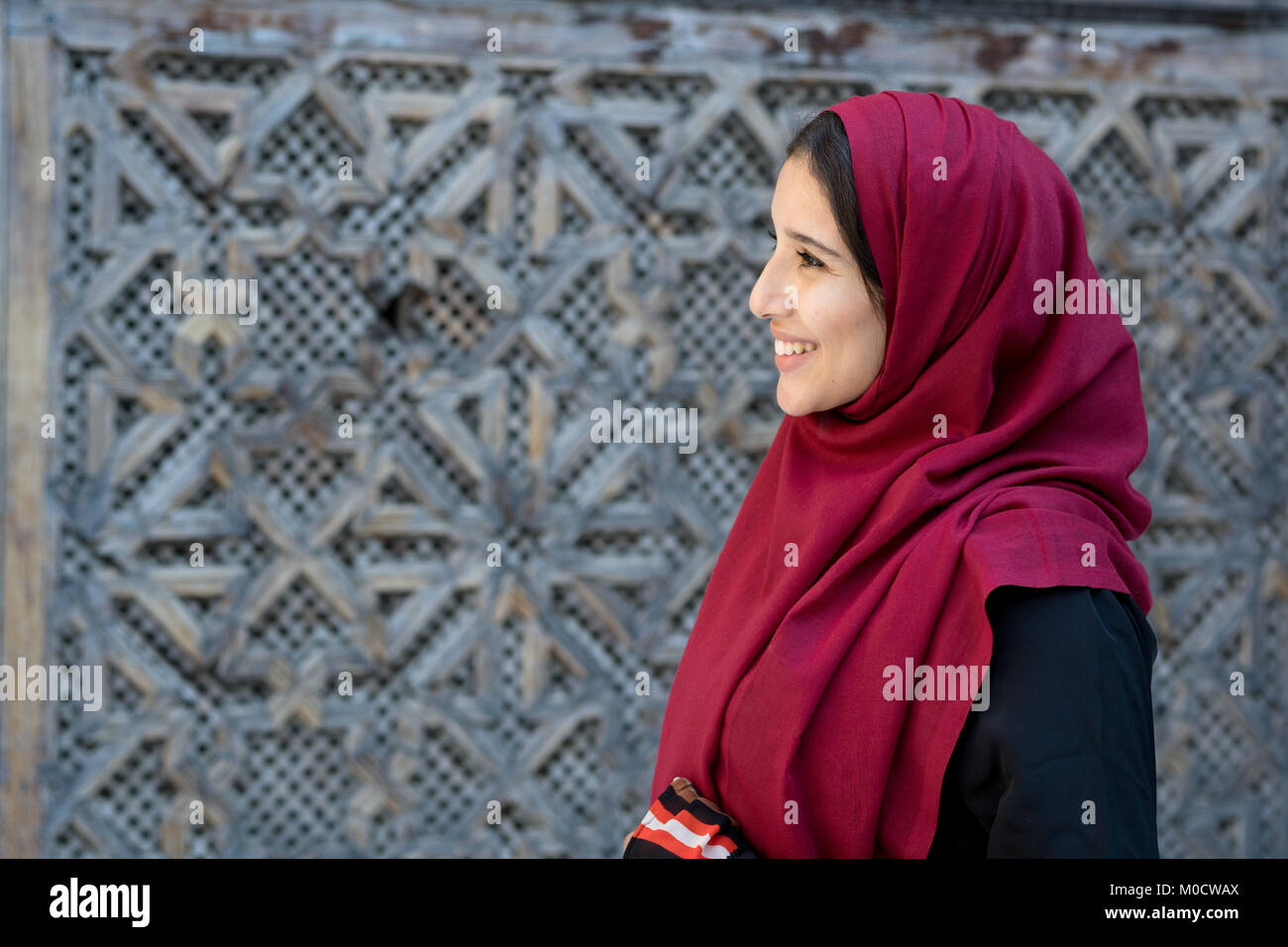 Portrait of beautiful Arab woman in traditional clothing with red hijab ... Portrait of beautiful Arab woman in traditional clothing with red hijab ...