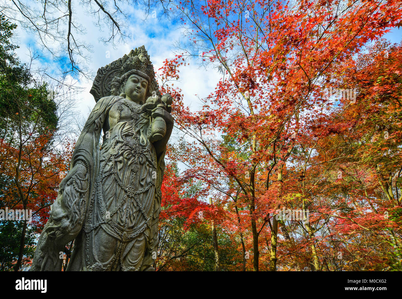 A Buddha statue at autumn garden in Kyoto, Japan Stock Photo - Alamy