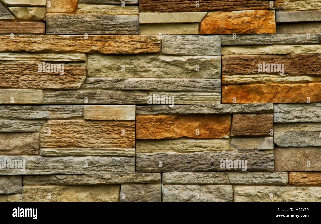 Dry Stacked Slate Rock Background in Sandstone Colors Stock Photo - Alamy