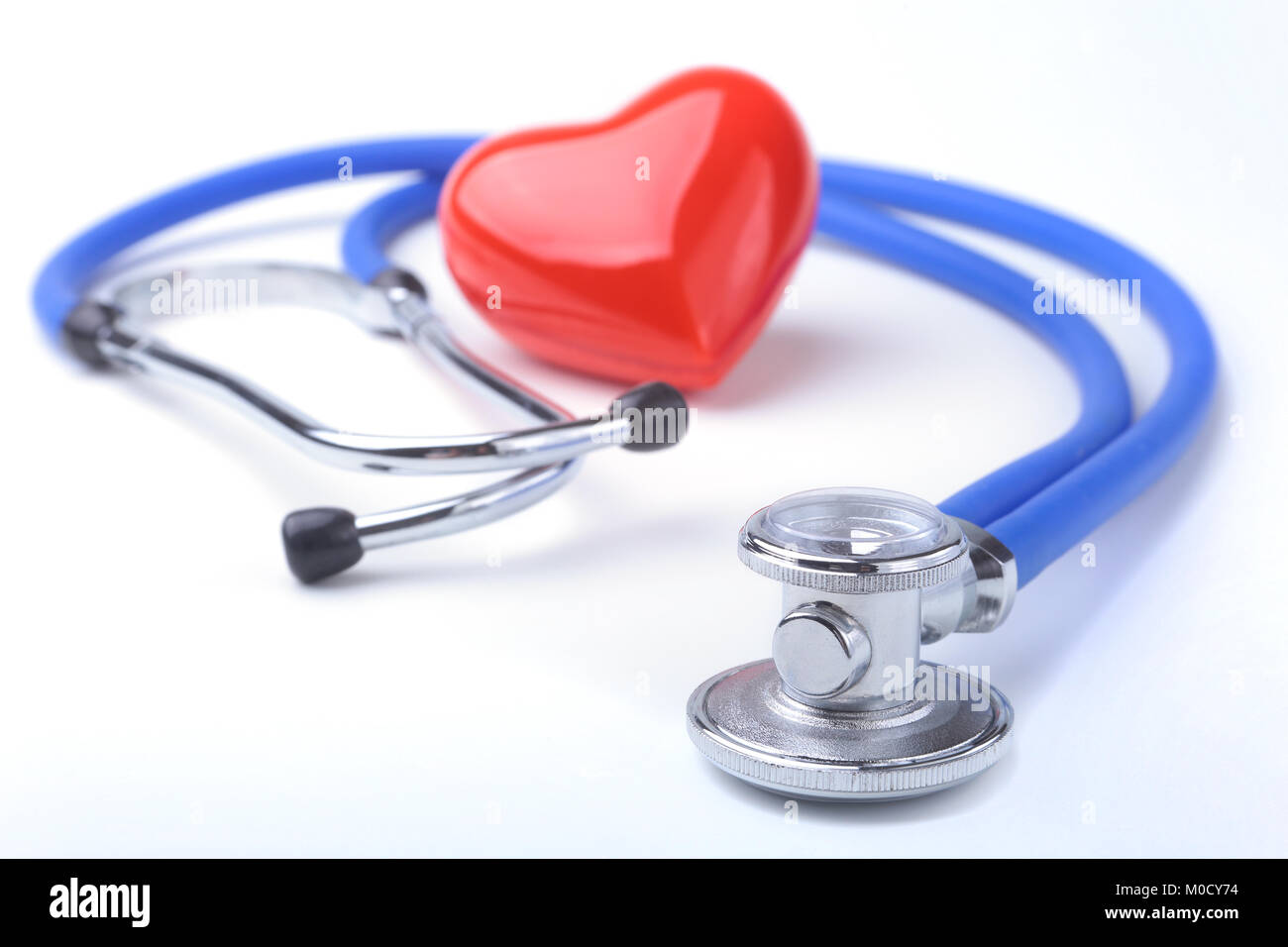 Red heart and a stethoscope on white background Stock Photo - Alamy