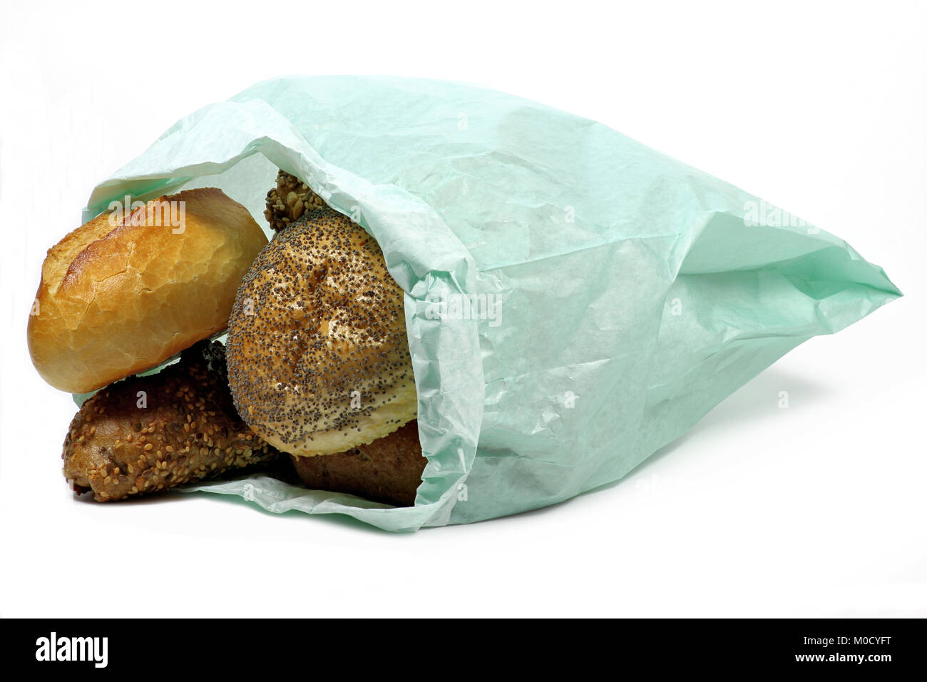fresh German style bread rolls in paper bag isolated on white ...