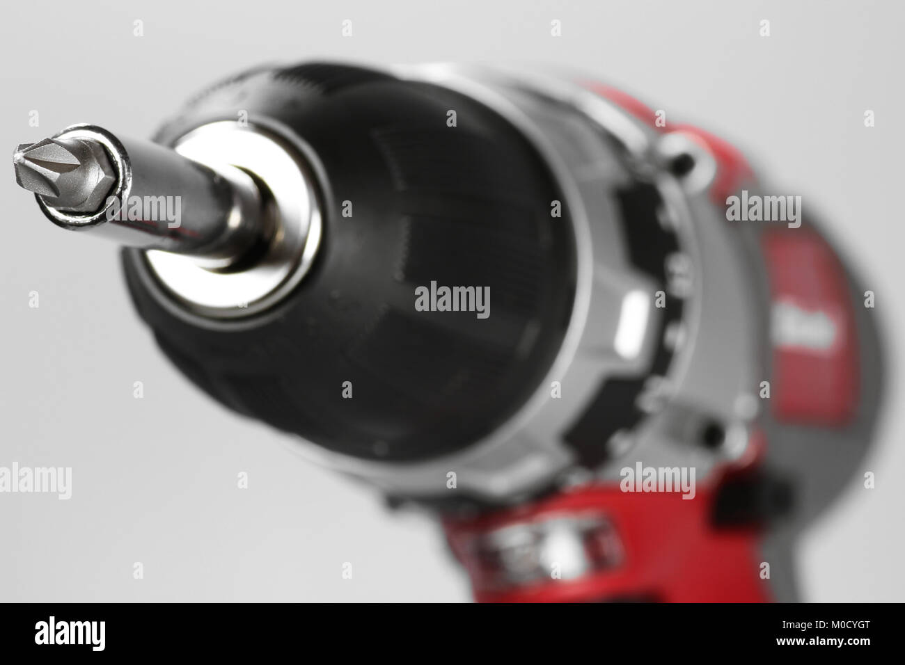 cordless screwdriver against grey background Stock Photo - Alamy