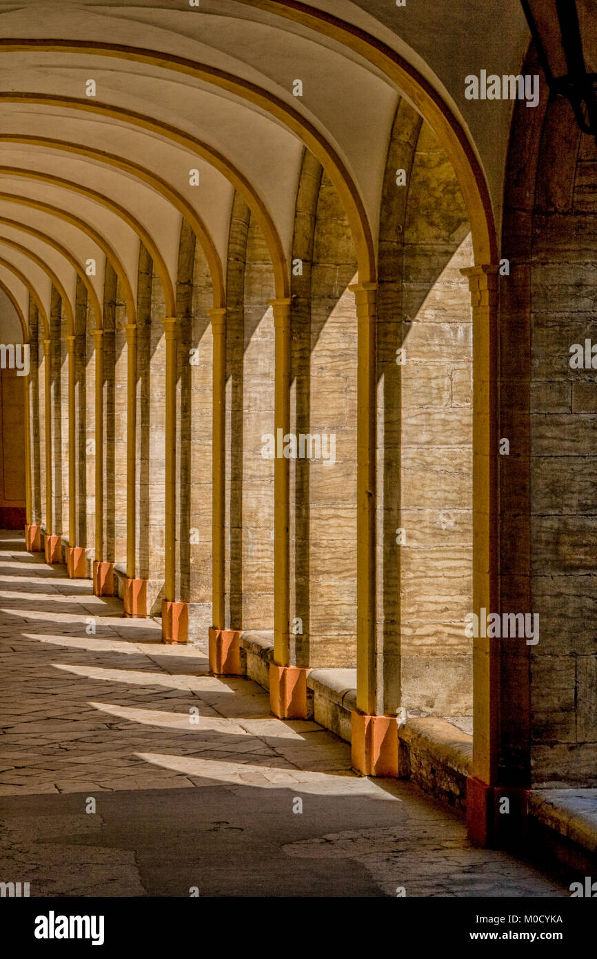 Sunlight through arches of medieval convent falling on stones Stock ...