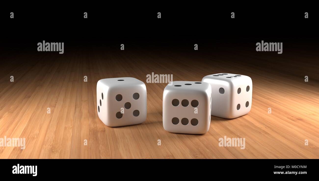 Close up of three dice on wood, with black fading in the background ...