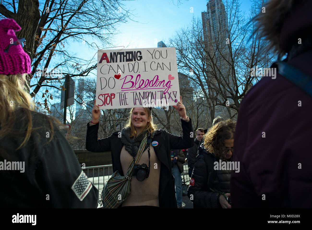New York, USA. 20th Jan, 2018. Woman holds "Stop the tampon tax" sign ...