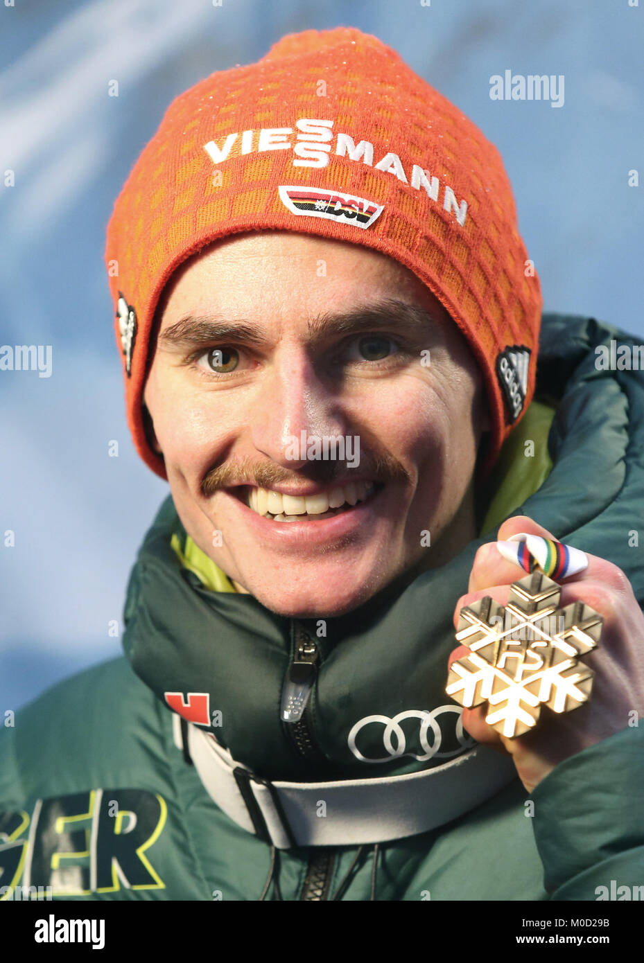 Richard Freitag of Germany holds up his bronze medal at the Ski Flying ...