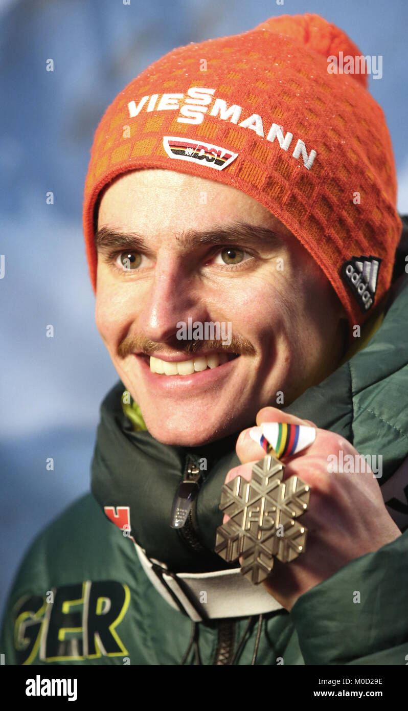 Richard Freitag of Germany holds up his bronze medal at the Ski Flying ...