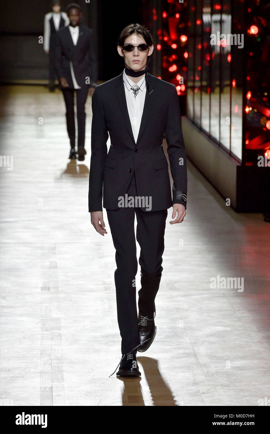 Paris. 20th Jan, 2017. A model presents a creation of Dior Homme during ...