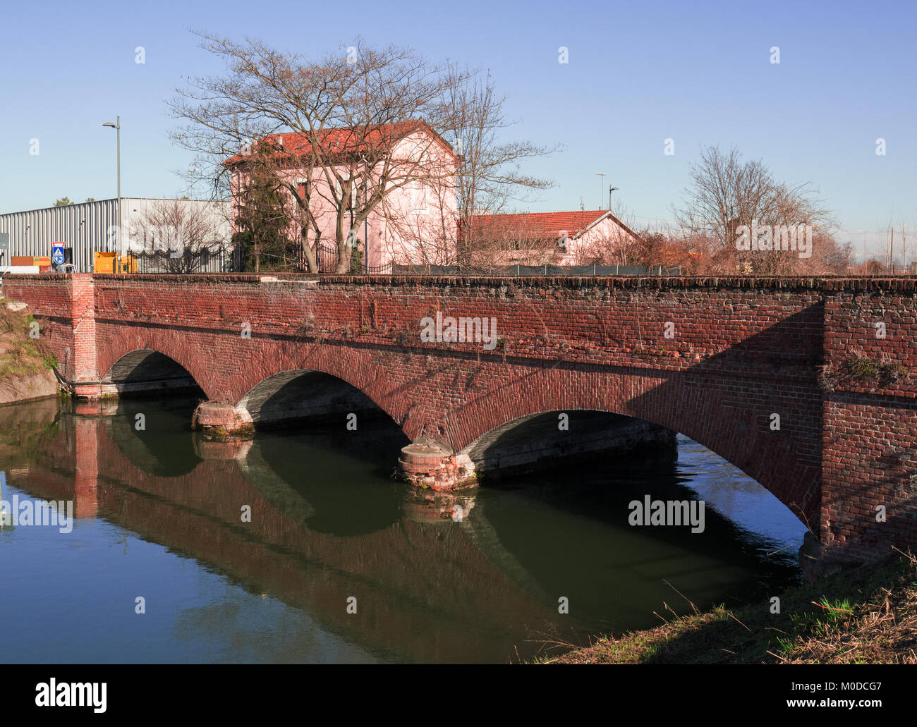 brick structure of an arched bridge over an irrigation canal Stock ...