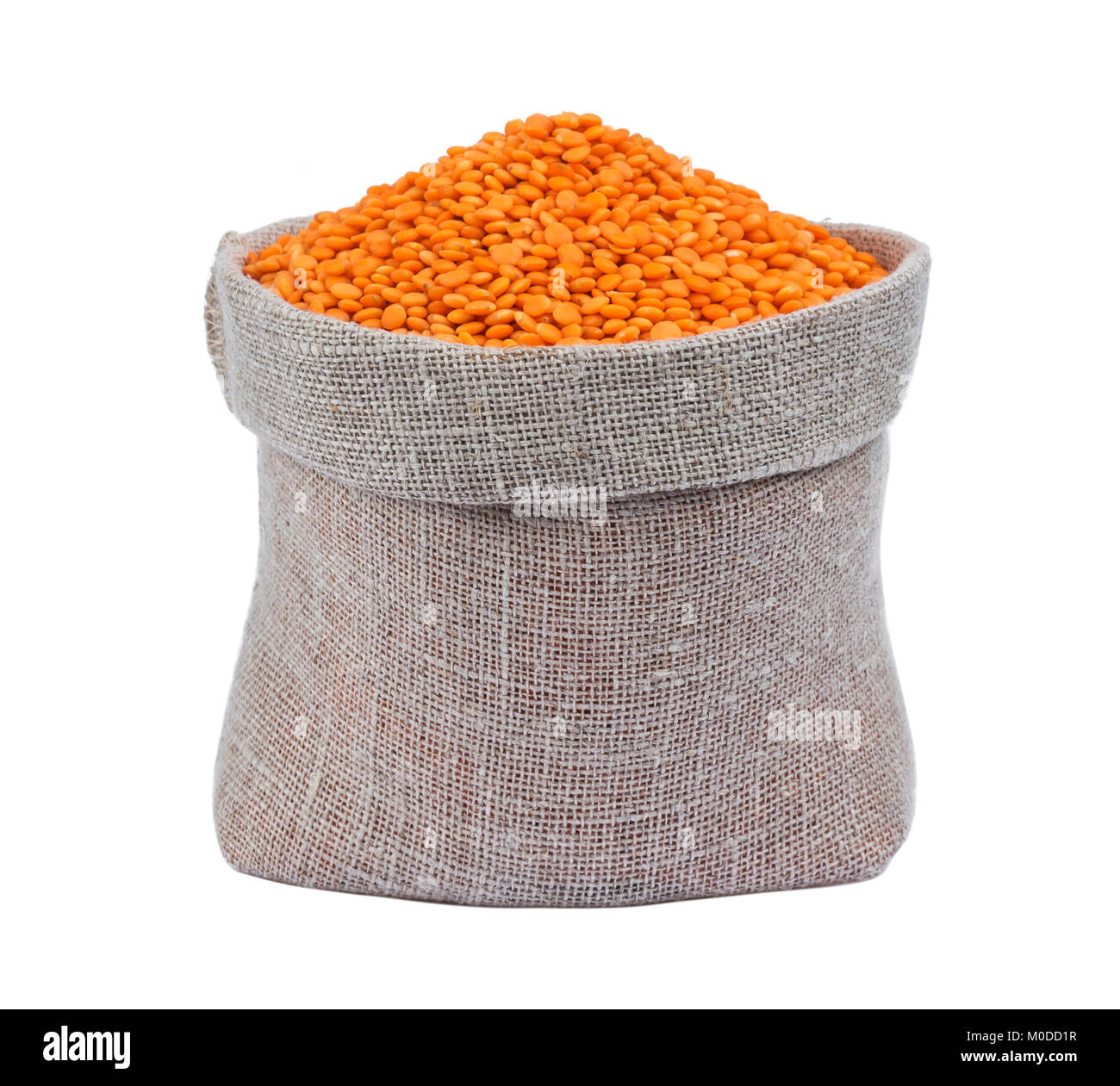 Red lentils in bag isolated on white background Stock Photo - Alamy