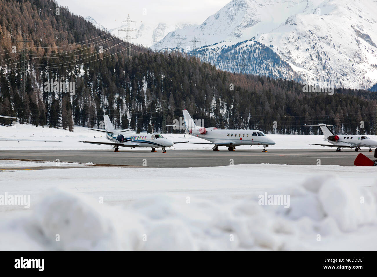 Private jets, planes and aircrafts in the snow covered landscape and ...