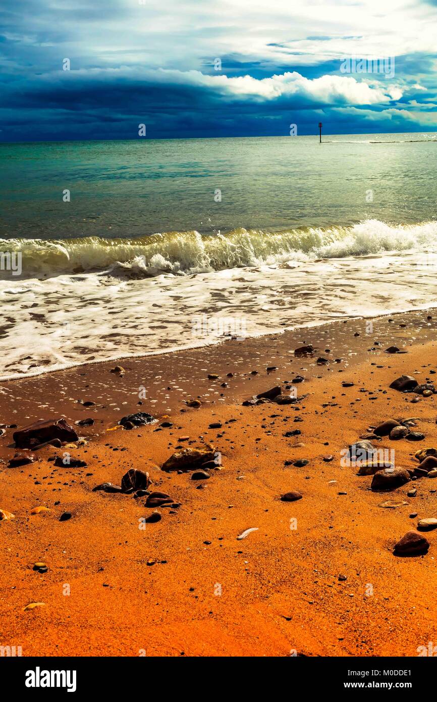 Red sandy beach with deep blue sky in South Devon, England Stock Photo ...