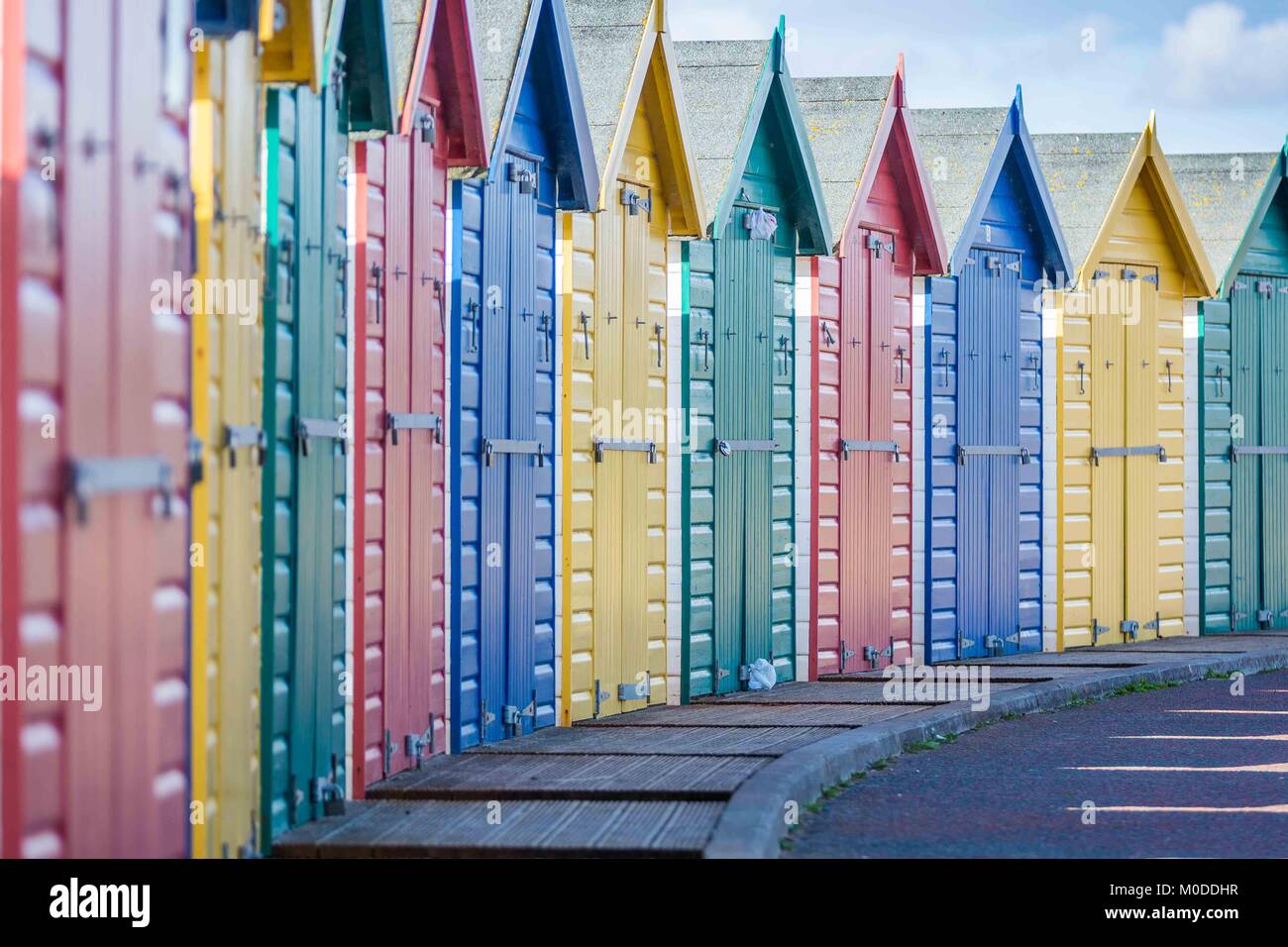 A row of Beach Huts or changing rooms at Dawlish Warren, Devon, UK ...