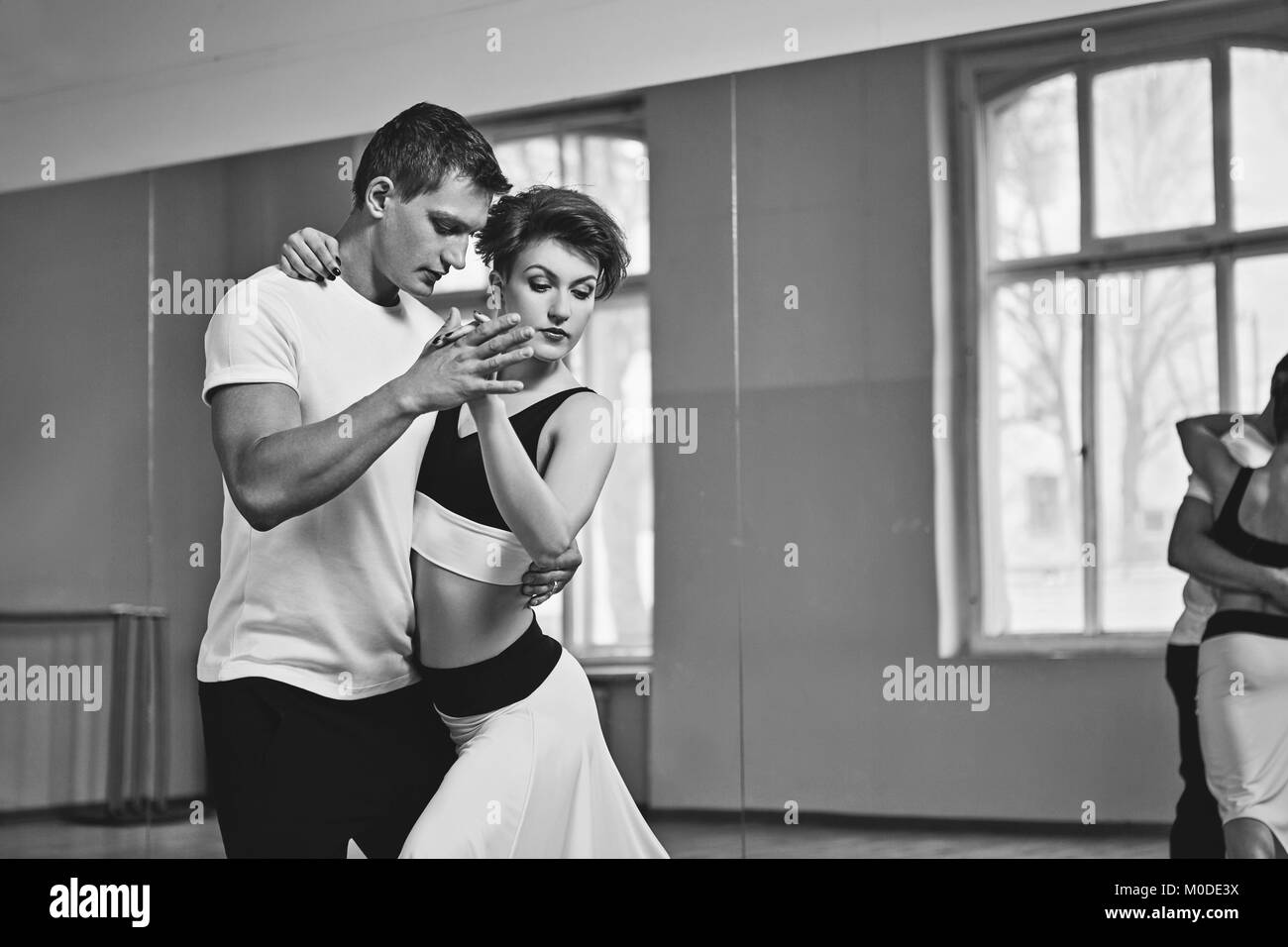 Attractive male and female dancing tango Black and White Stock Photos & Images - Alamy