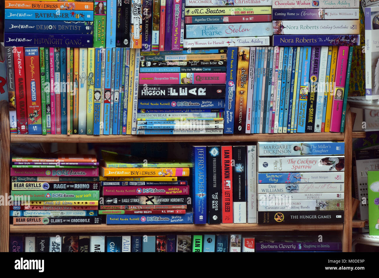 a colourful selection and variety of paper back books in a second hand ...