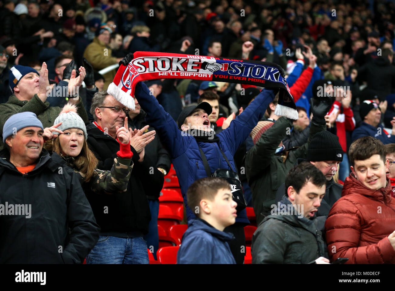 Stoke City fans in the stands Stock Photo - Alamy