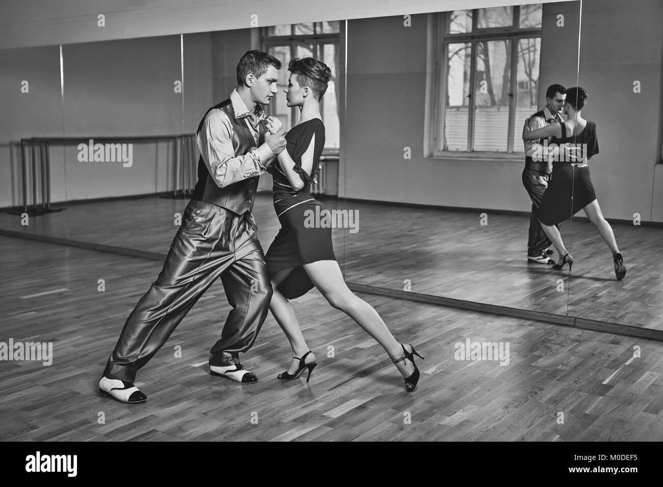 beautiful couple dancing tango Stock Photo - Alamy