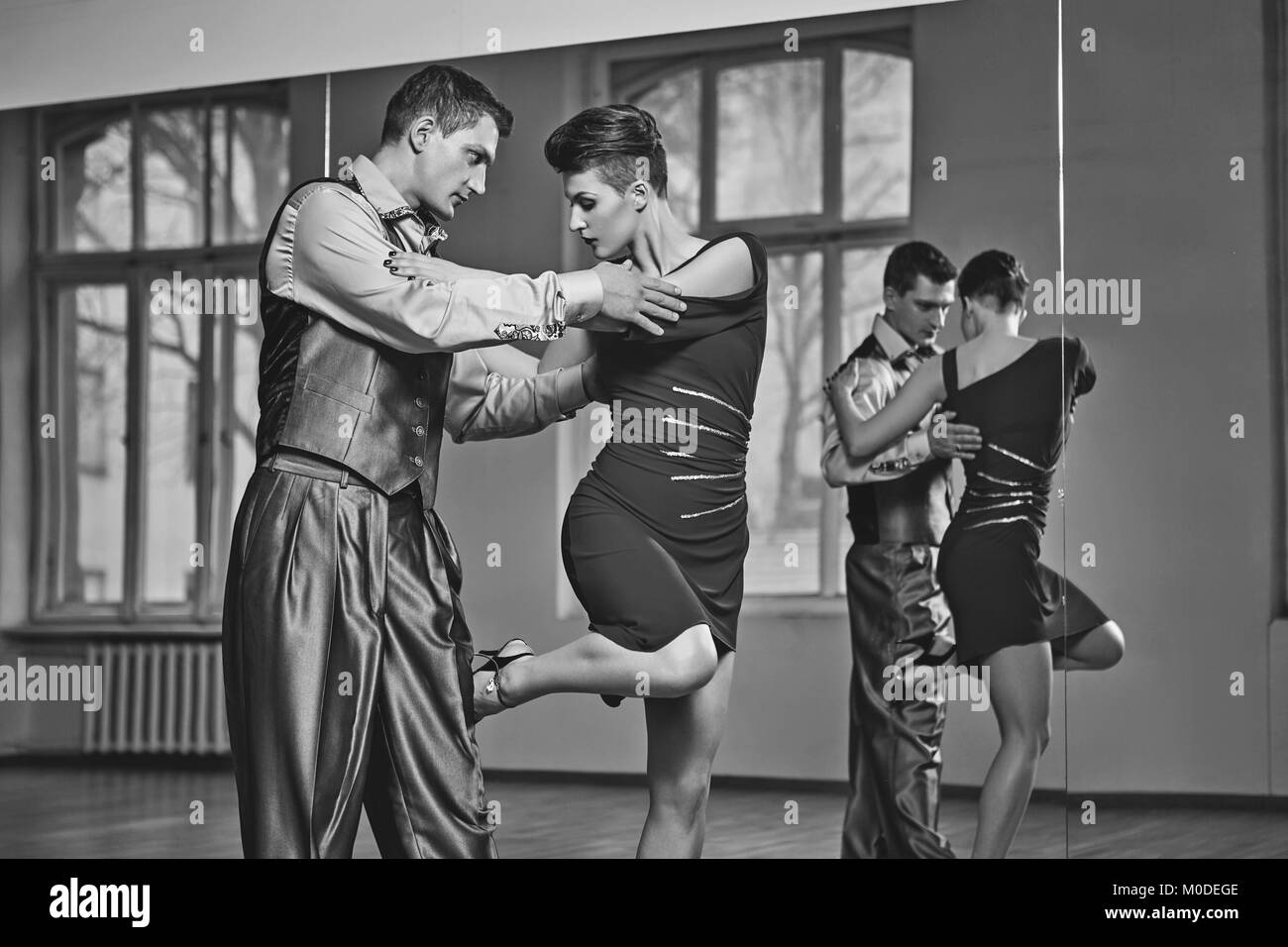 Attractive male and female dancing tango Black and White Stock Photos & Images - Alamy
