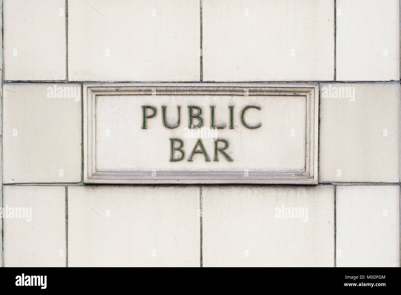 front view of traditional British pub public bar sign on a white brick ...