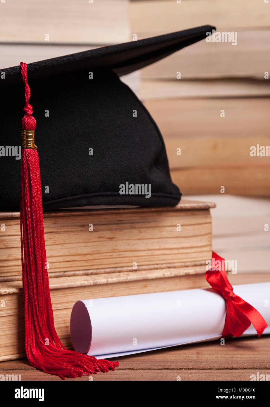 Books and diploma on table hi-res stock photography and images - Alamy