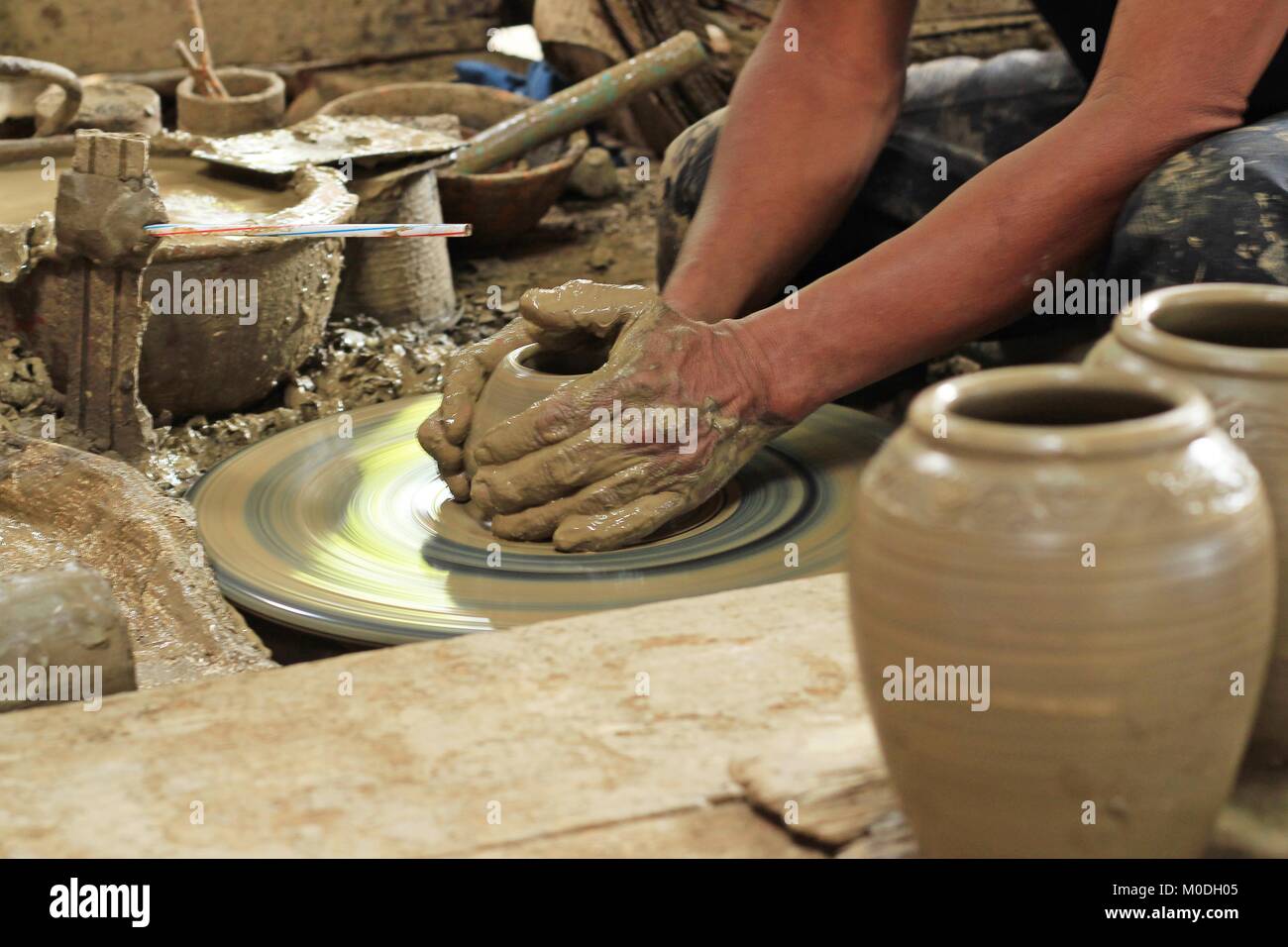 Potter at work. potter making ceramic pot on the pottery wheel Stock ...