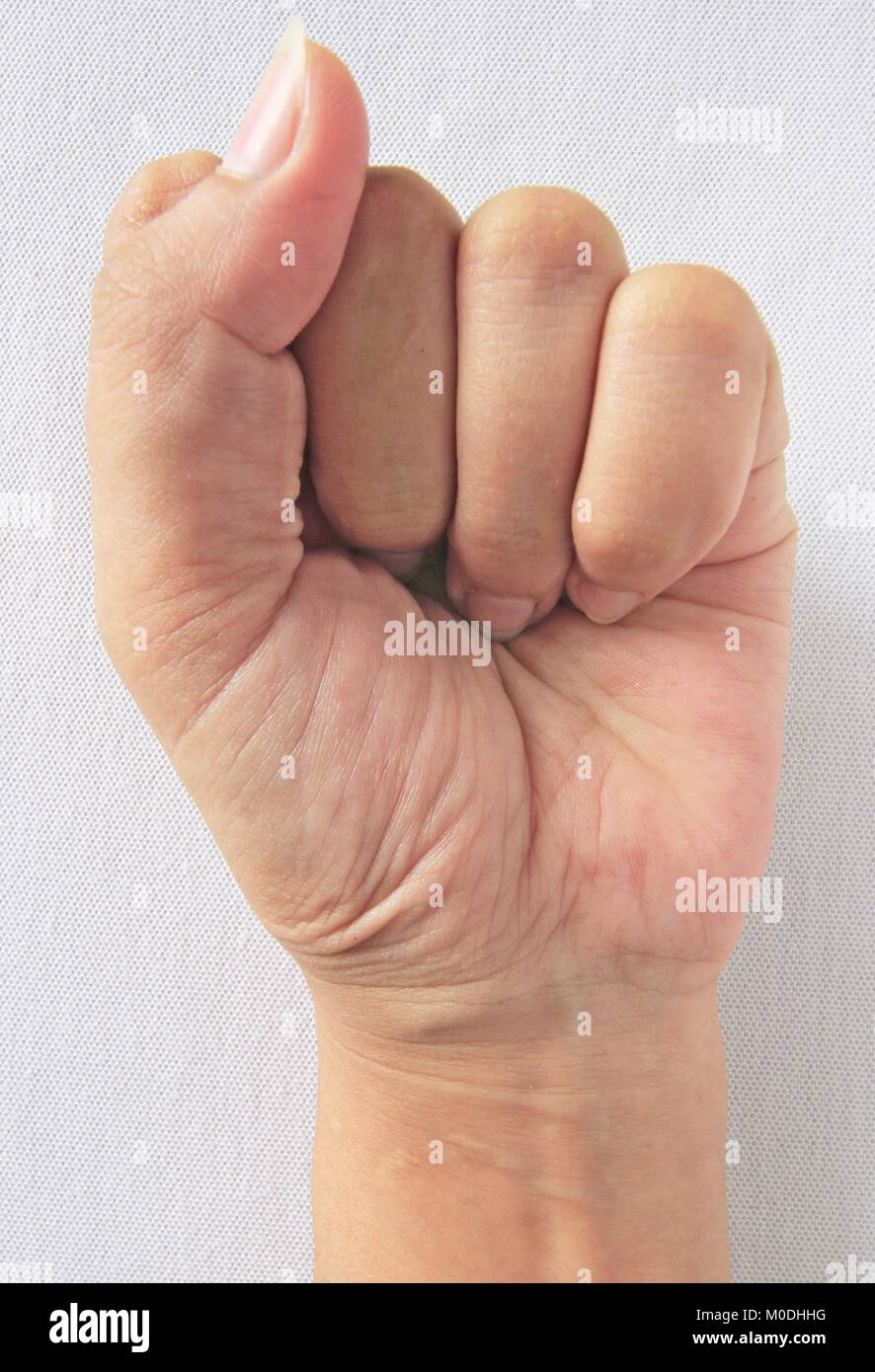 Show handful of women on white fabric Stock Photo - Alamy
