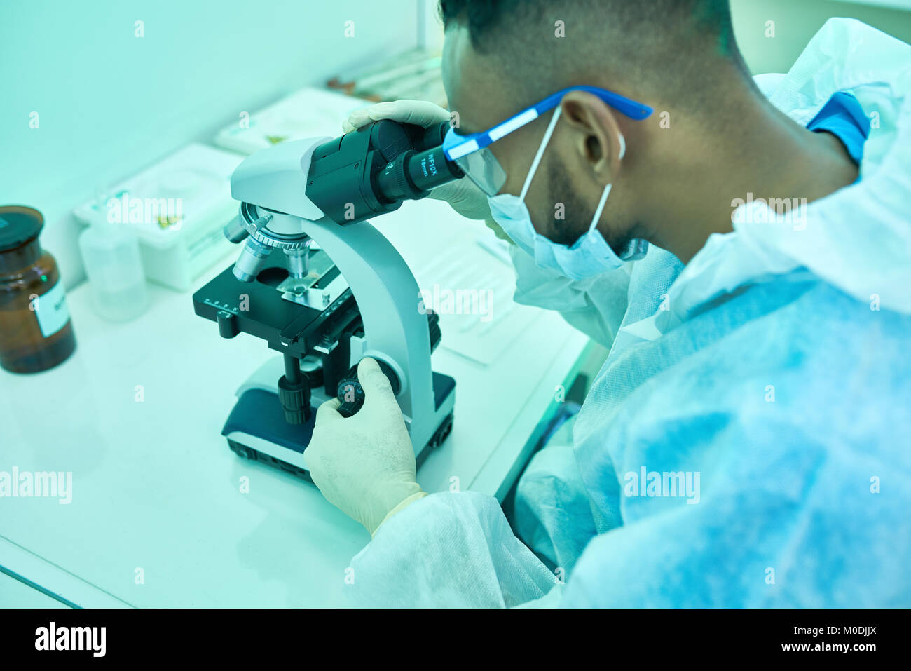 Scientist Using Microscope in Medical Lab Stock Photo - Alamy