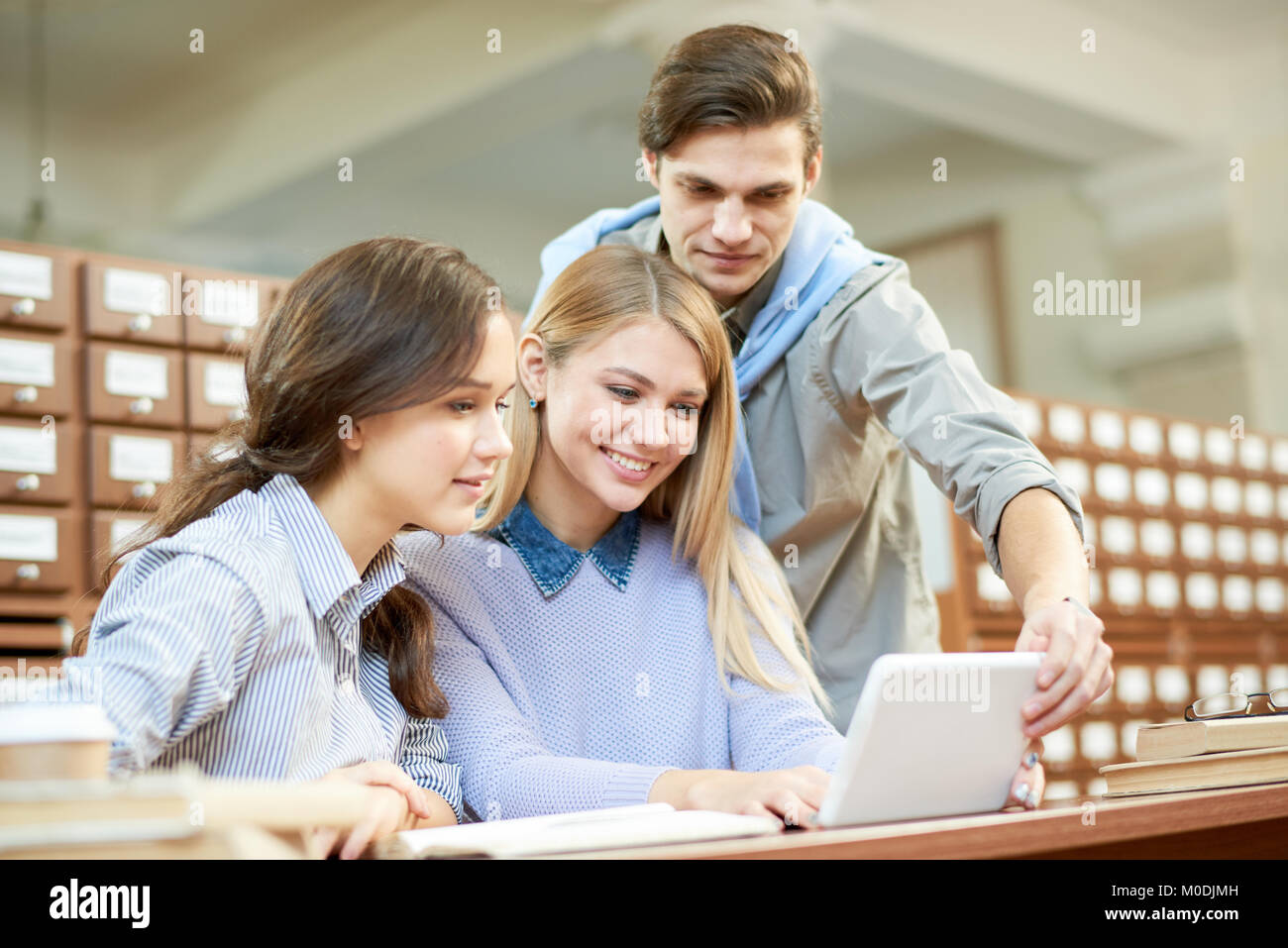 College Students Working on Joint Project Stock Photo - Alamy
