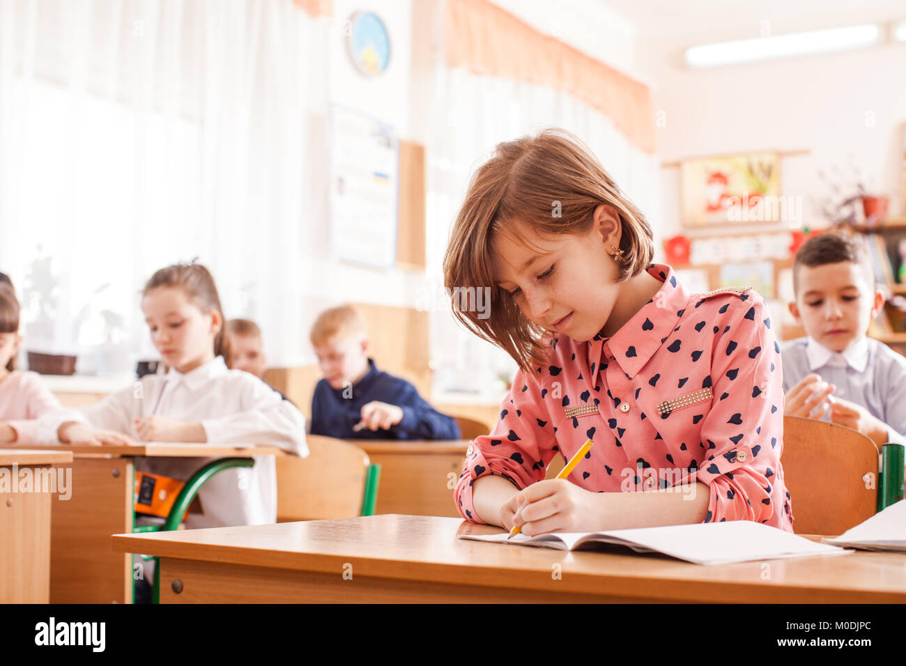 Writing at the copybook Stock Photo - Alamy