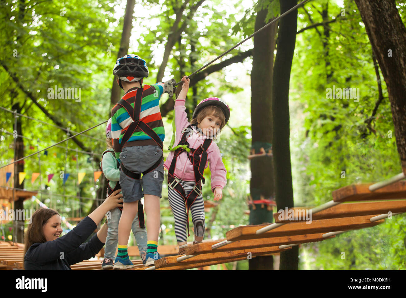 Children in a adventure playground Stock Photo - Alamy