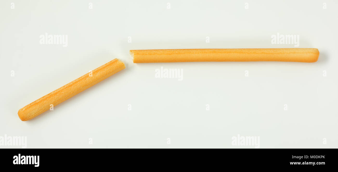 broken bread stick on white background Stock Photo - Alamy