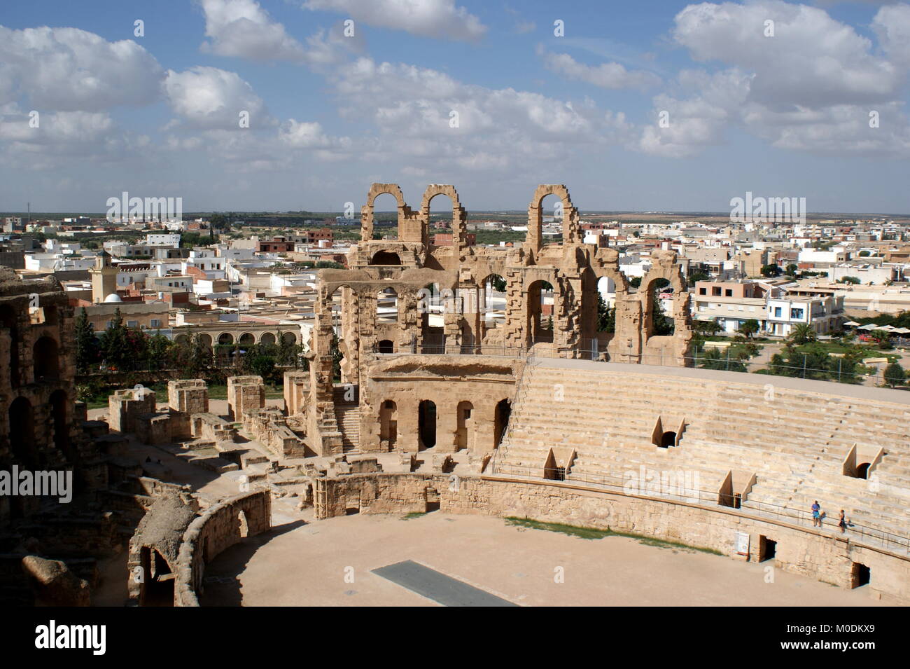 View of the ancient El Jem Roman amphitheatre and the modern town of El ...