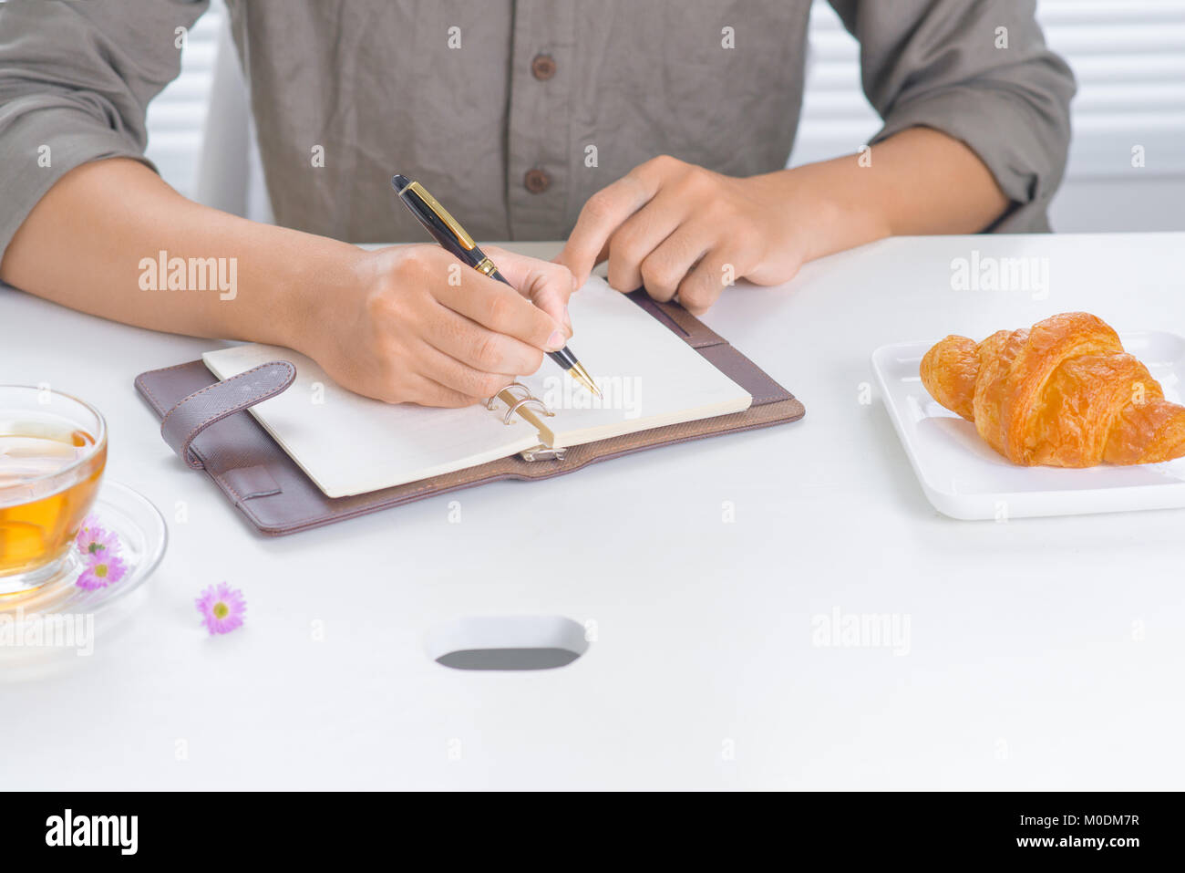 A man writing journal at home in the morning Stock Photo - Alamy