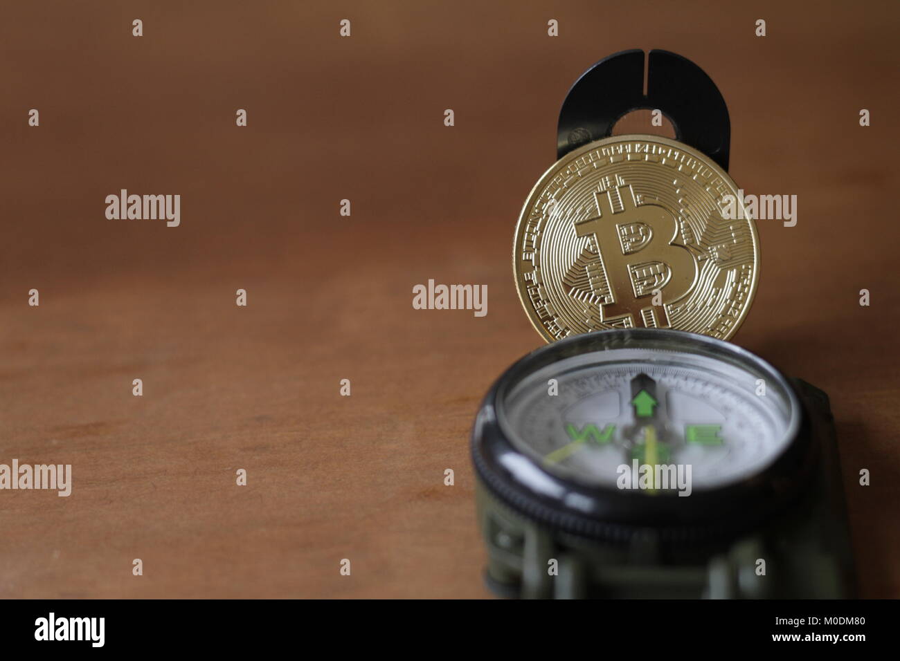 Compass and Bitcoin - Finding Your Way Stock Photo - Alamy