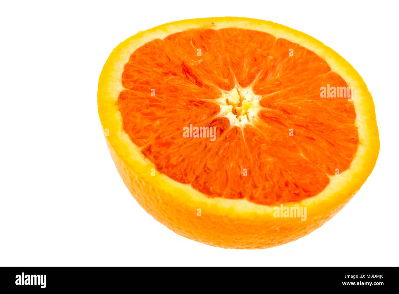 Close up of fresh sunkist orange cut half isolated on white background ...