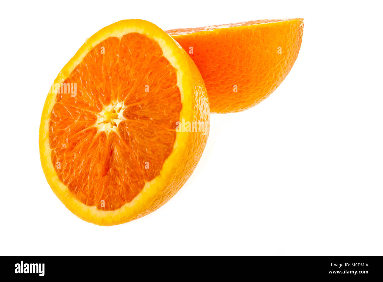 Close up of fresh sunkist orange cut half isolated on white background ...