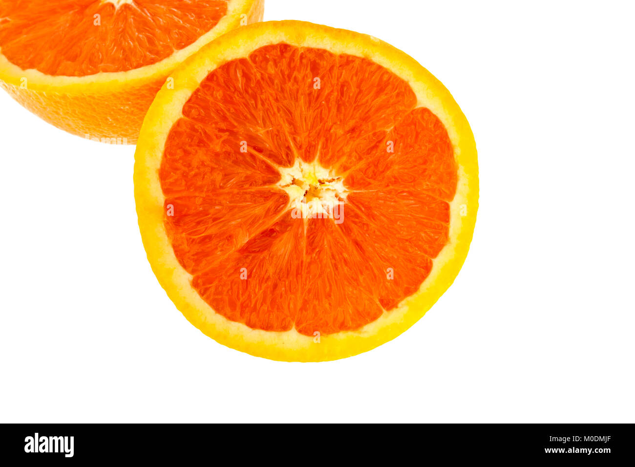 Close up of fresh sunkist orange cut half isolated on white background ...