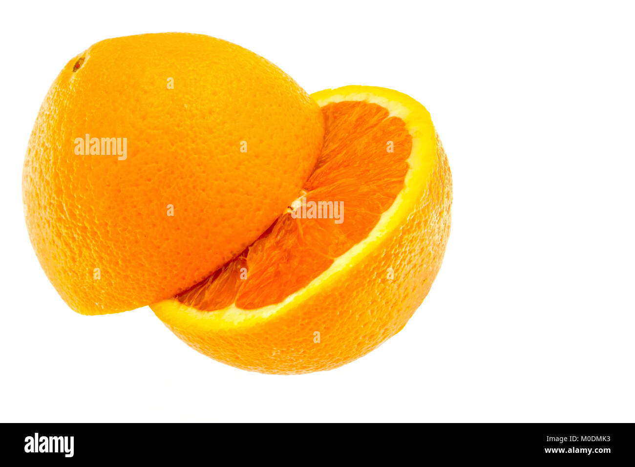 Close up of fresh sunkist orange cut half isolated on white background ...