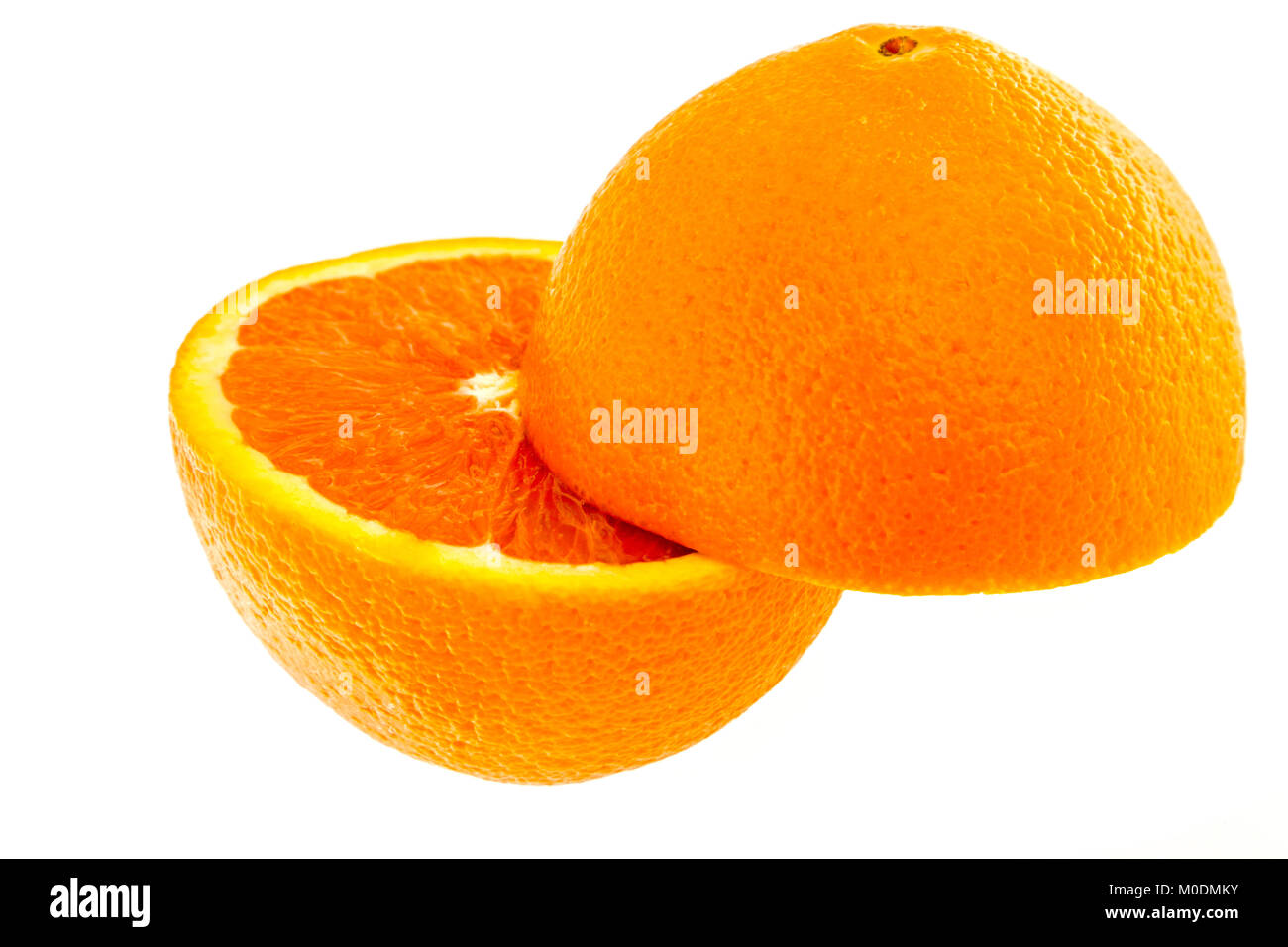 Close up of fresh sunkist orange cut half isolated on white background ...