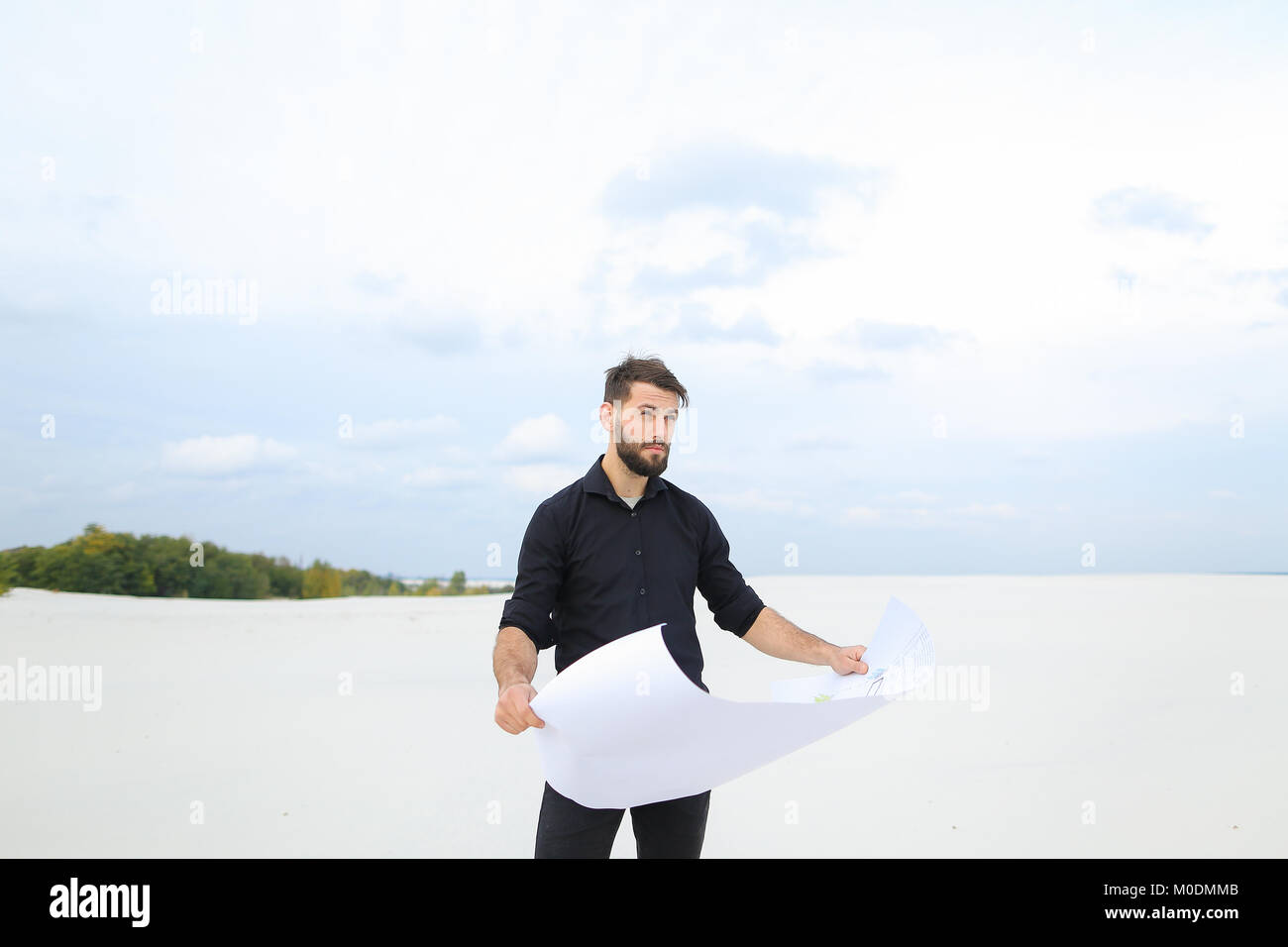 Archeologist man reviewing plan of excavations in village talk Stock ...