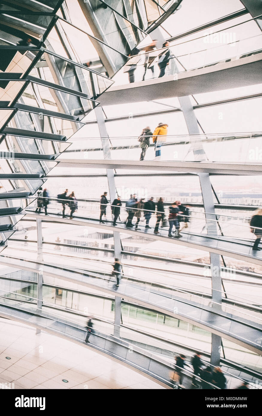 People walking around the glass copula dome at the German Reichstag ...