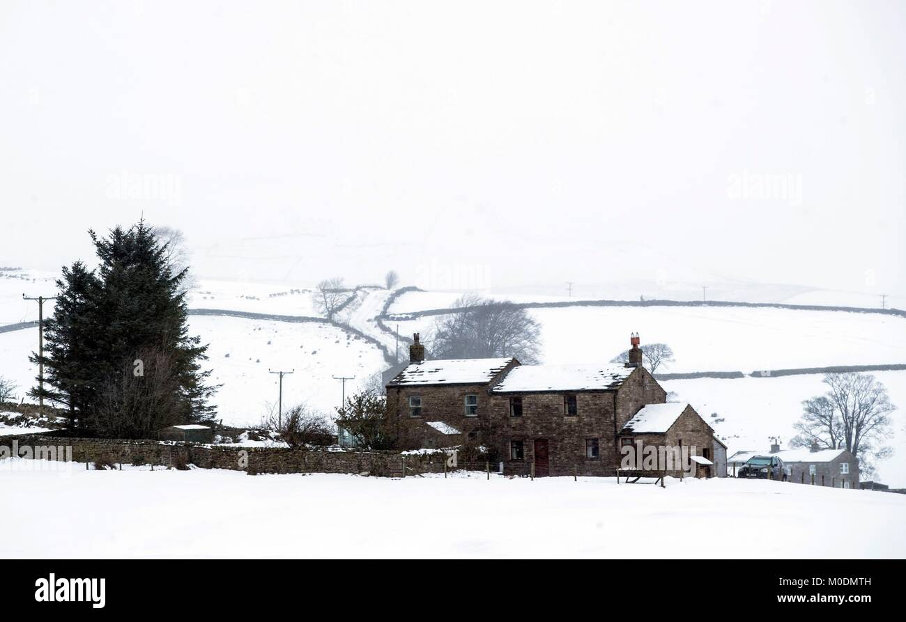 A farmhouse covered in snow near Hawes in the Yorkshire Dales National ...