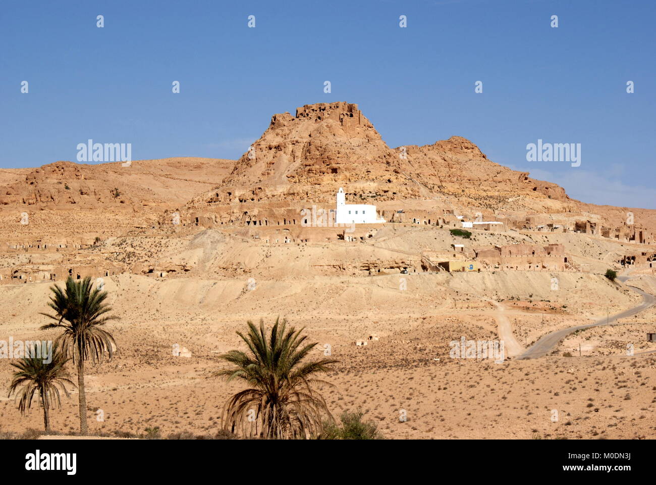 View of the abandoned hilltop Berber village of Douiret and the ...
