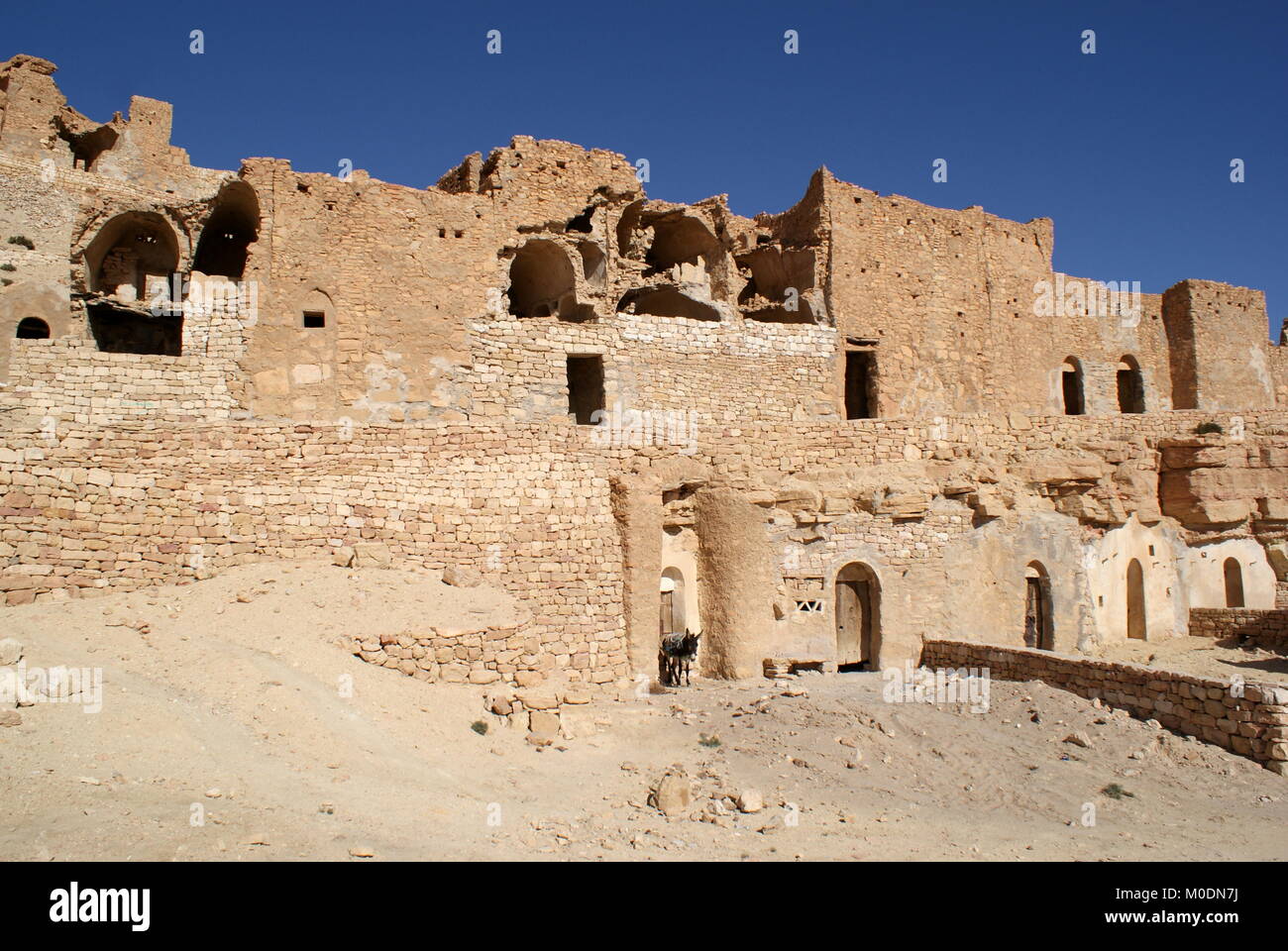 The abandoned hilltop Berber village and troglodyte houses of Douiret ...