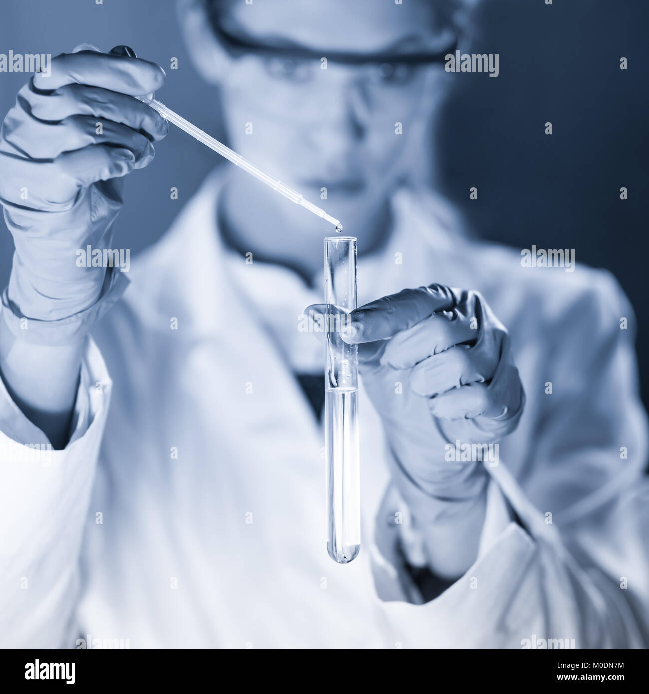 Scientist woman black test tube pipette hi-res stock photography and ...