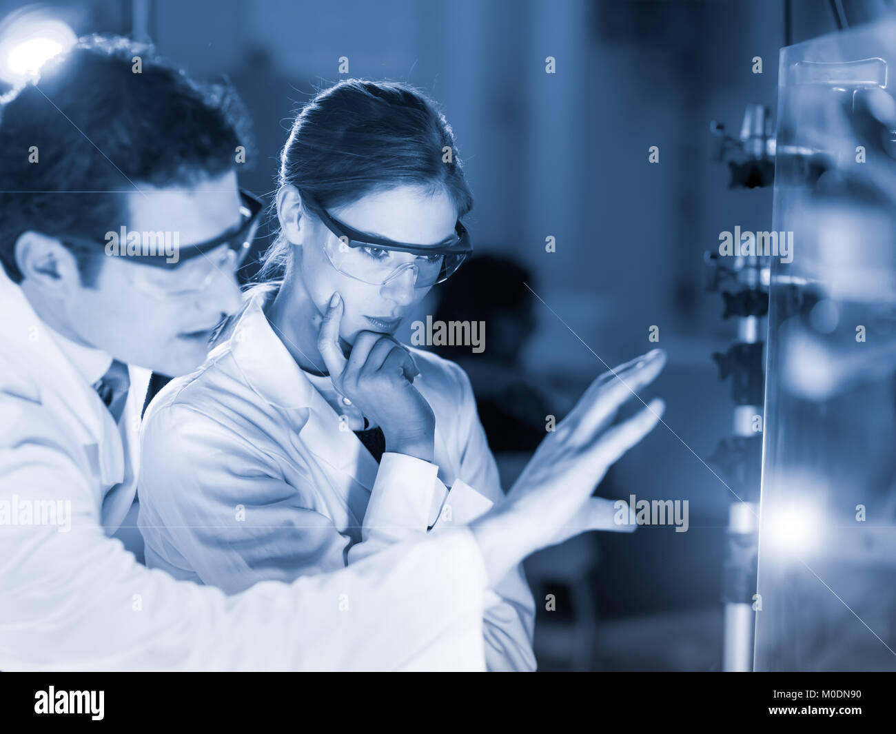 Engineers focusing on the discovery Stock Photo - Alamy