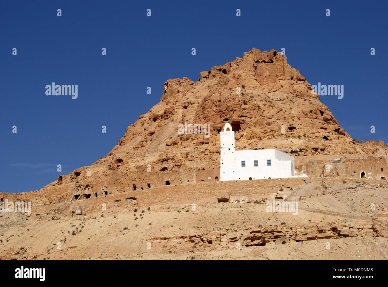 View of the abandoned hilltop Berber village of Douiret and the ...