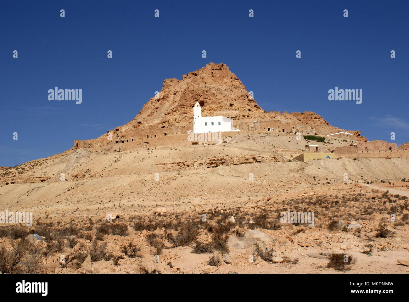 View of the abandoned hilltop Berber village of Douiret and the ...